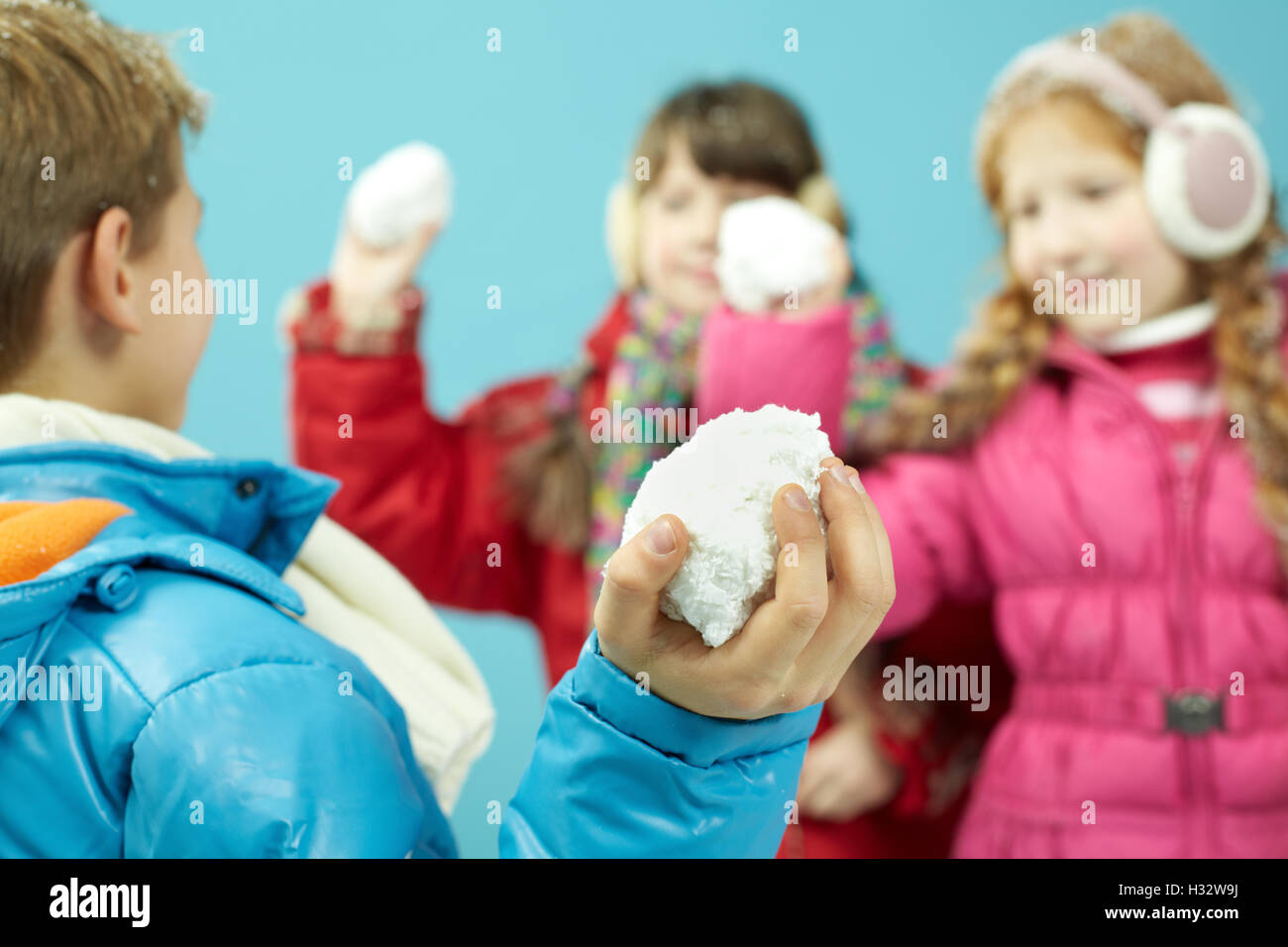 Playing snowball fight Stock Photo - Alamy