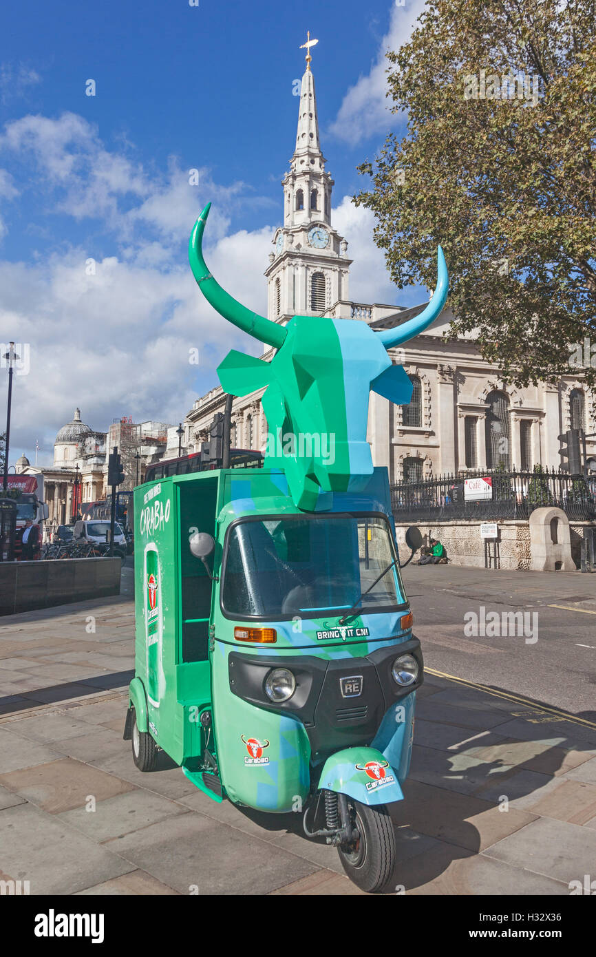 A colourful tuk-tuk waiting for custom in London's Duncannon Street ...