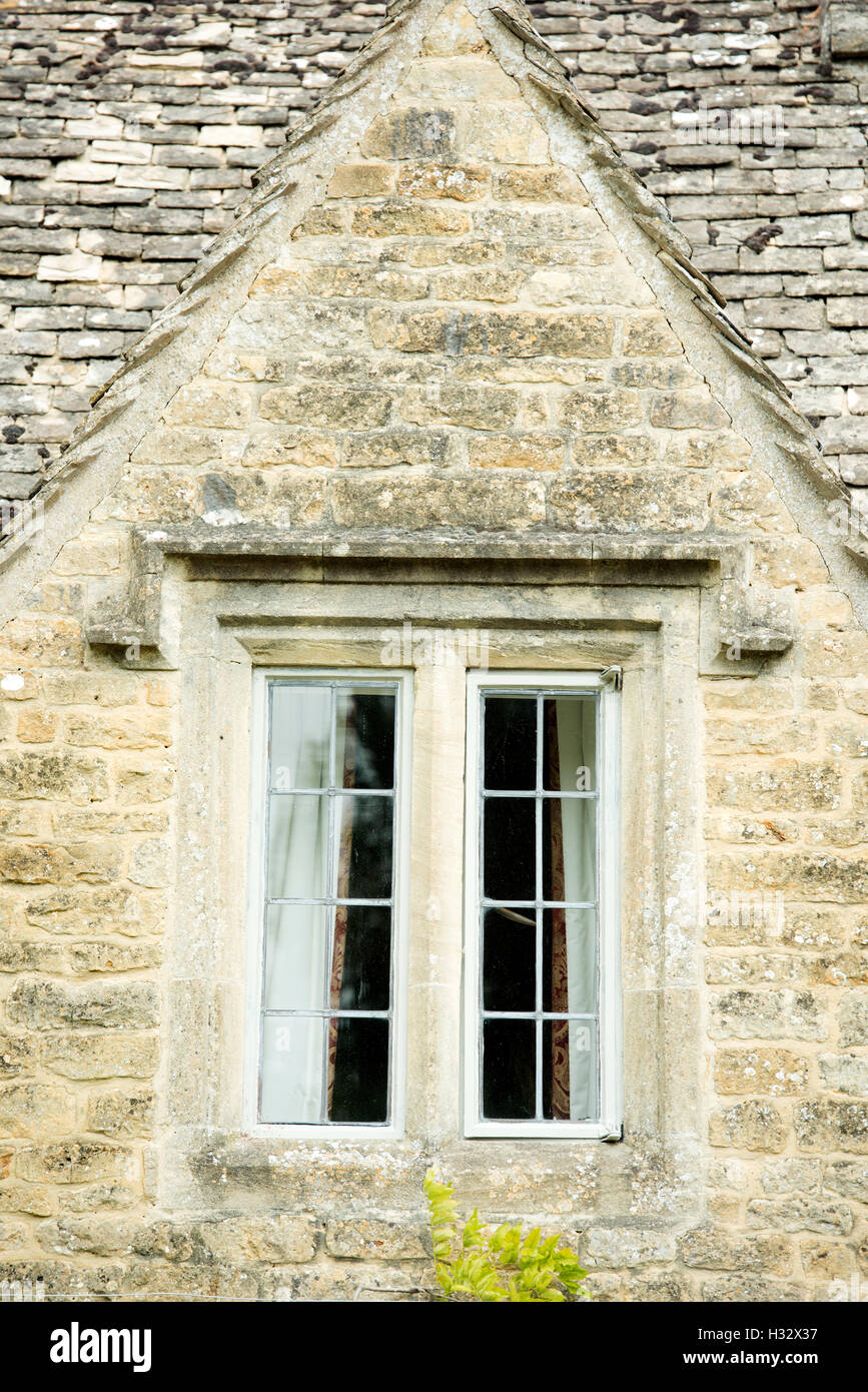 Detail of a cottage gable in the Cotswold village of Lower Slaughter ...
