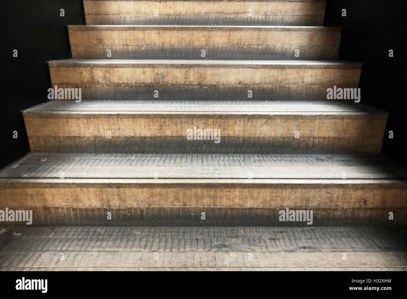 Set of light brown / beige concrete steps in a staircase leading ...