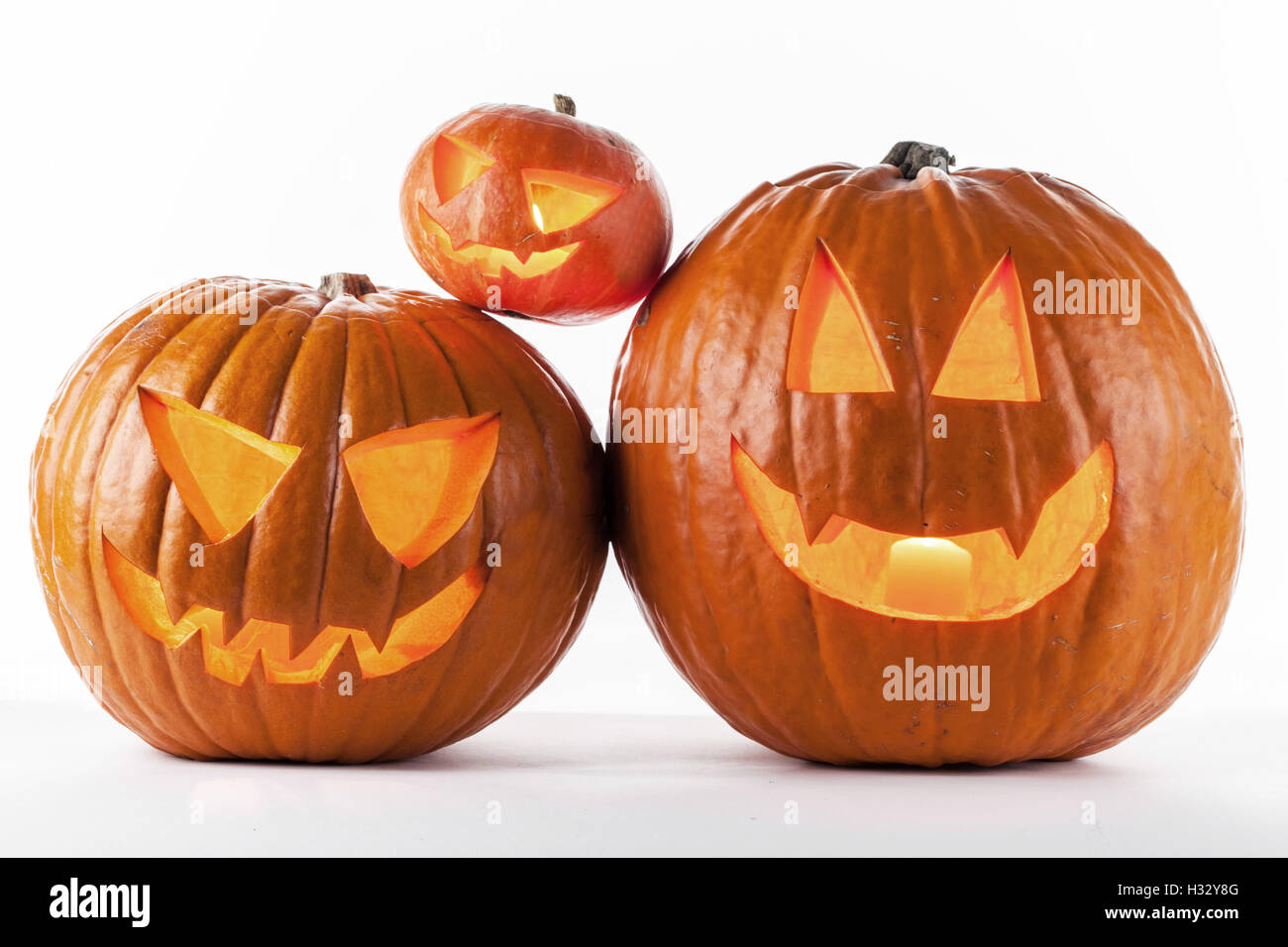 Glowing Halloween pumpkins isolated on white background Stock Photo - Alamy