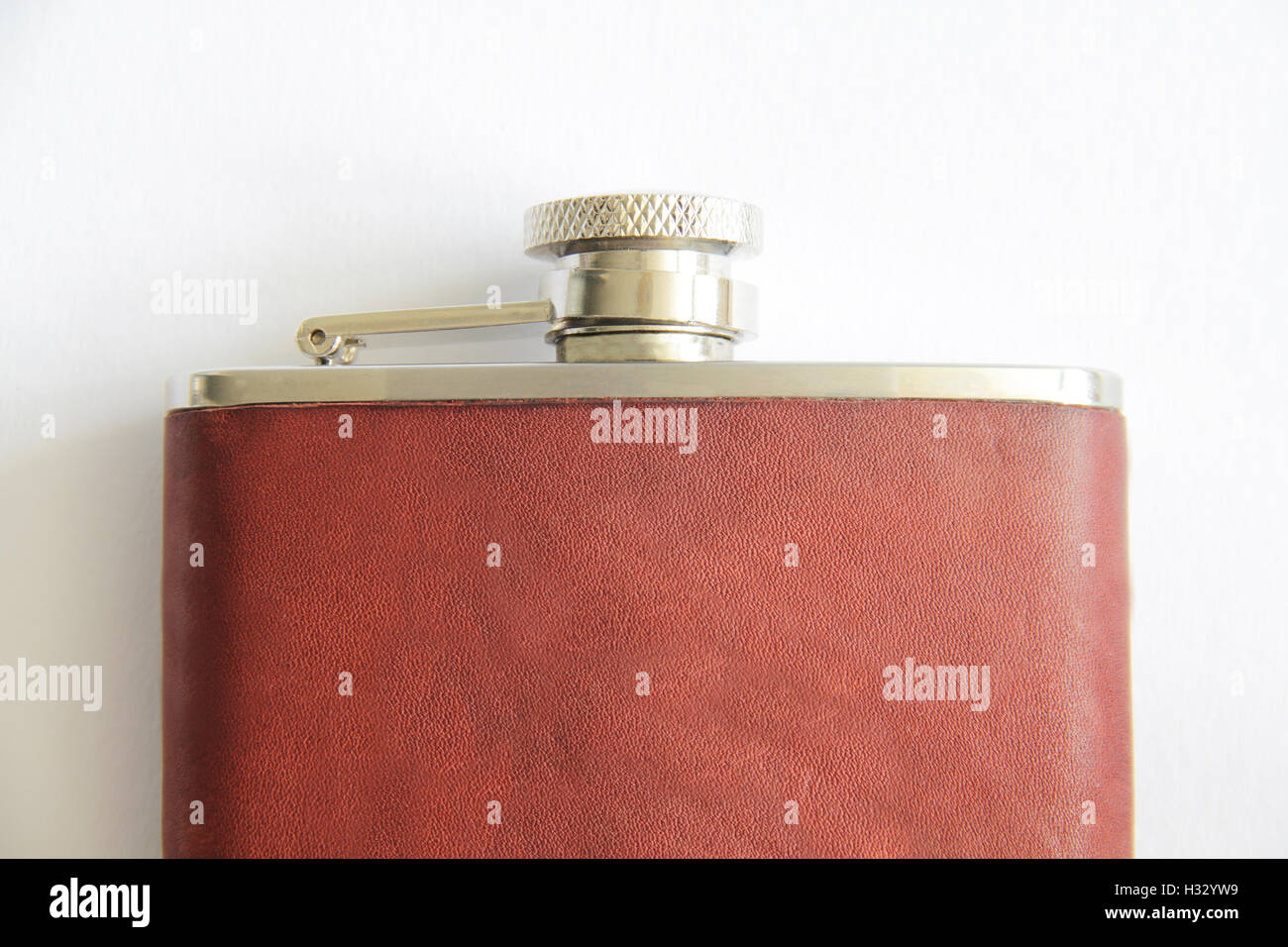 Flask of brown color for alcohol isolated on white Stock Photo - Alamy