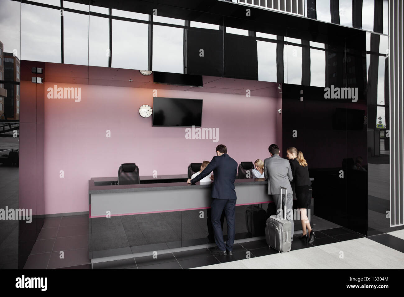 Woman Filling Form Reception Desk High Resolution Stock Photography and ...
