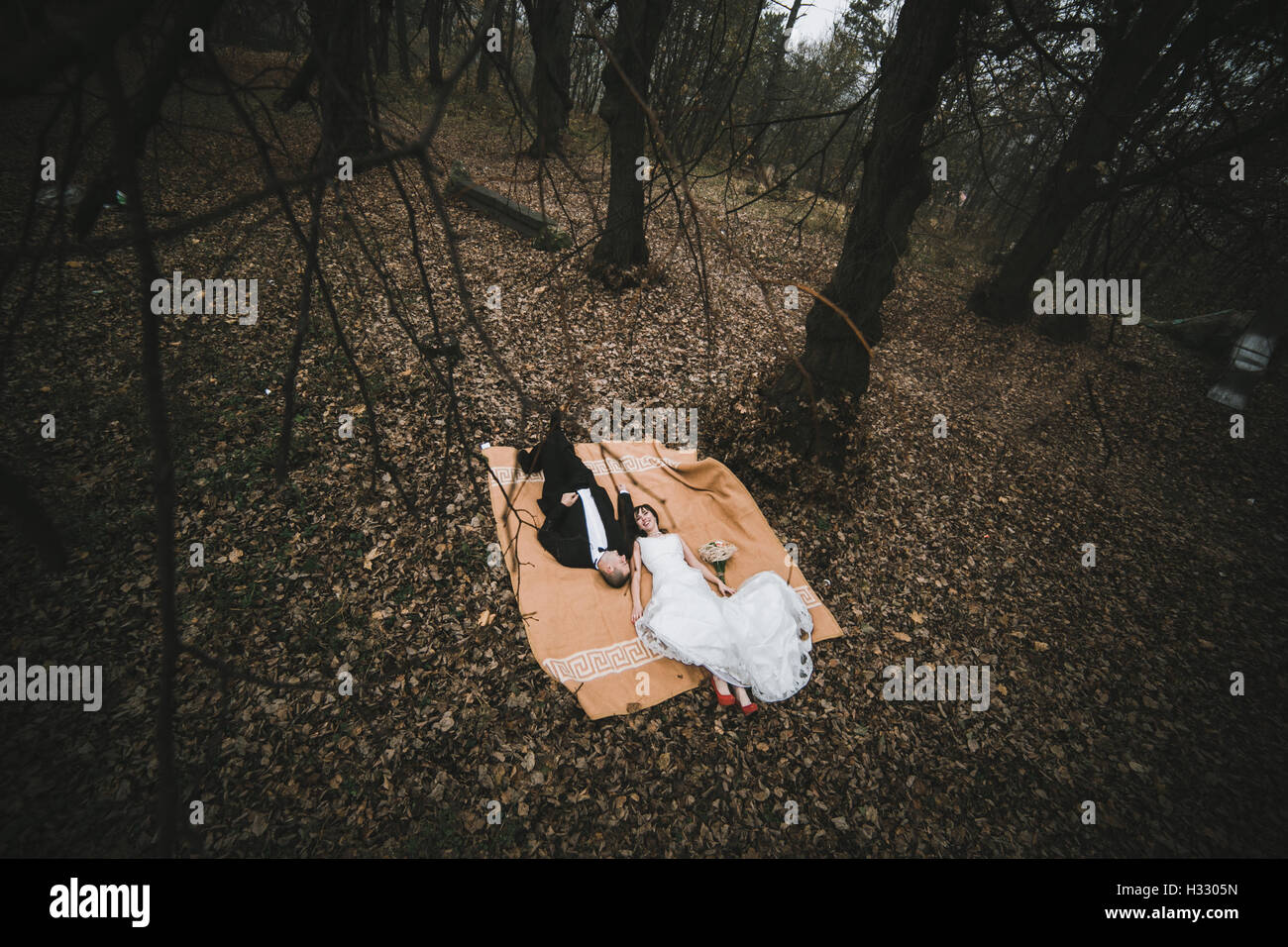 Couple lying down Stock Photo - Alamy