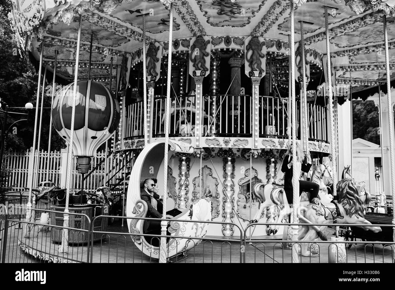 Woman riding horse on carousel Black and White Stock Photos & Images ...