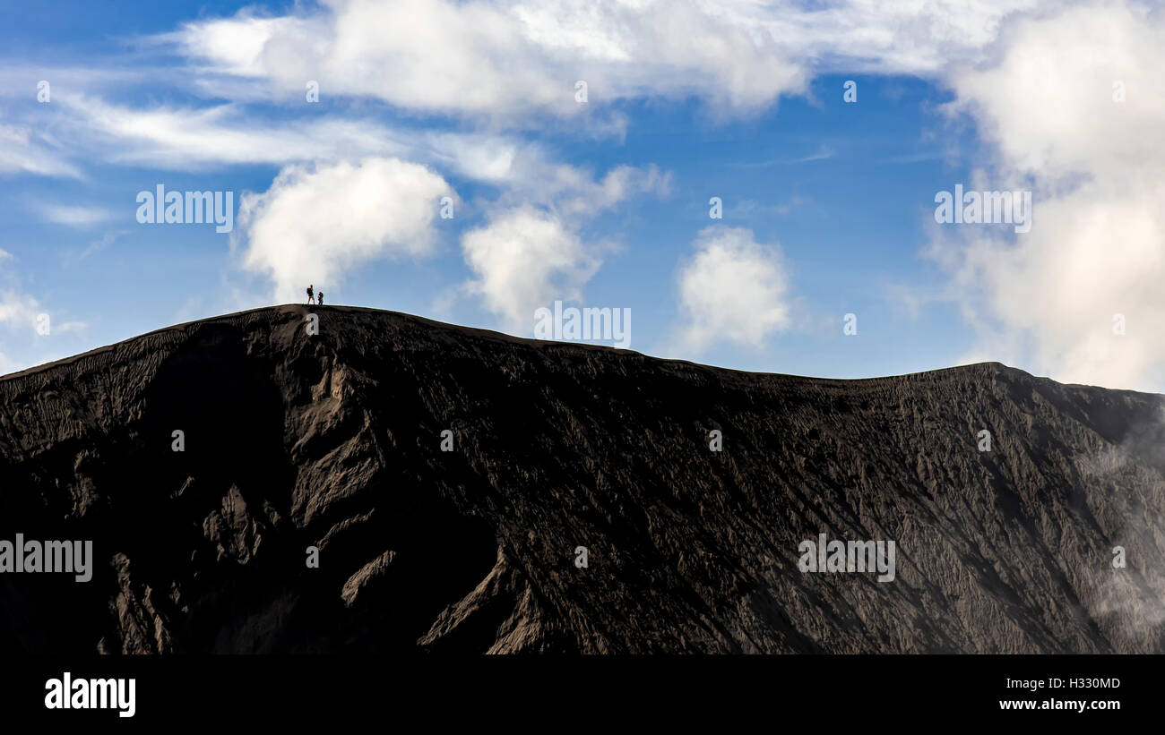 traveller walking on crater volcano mountain Stock Photo - Alamy
