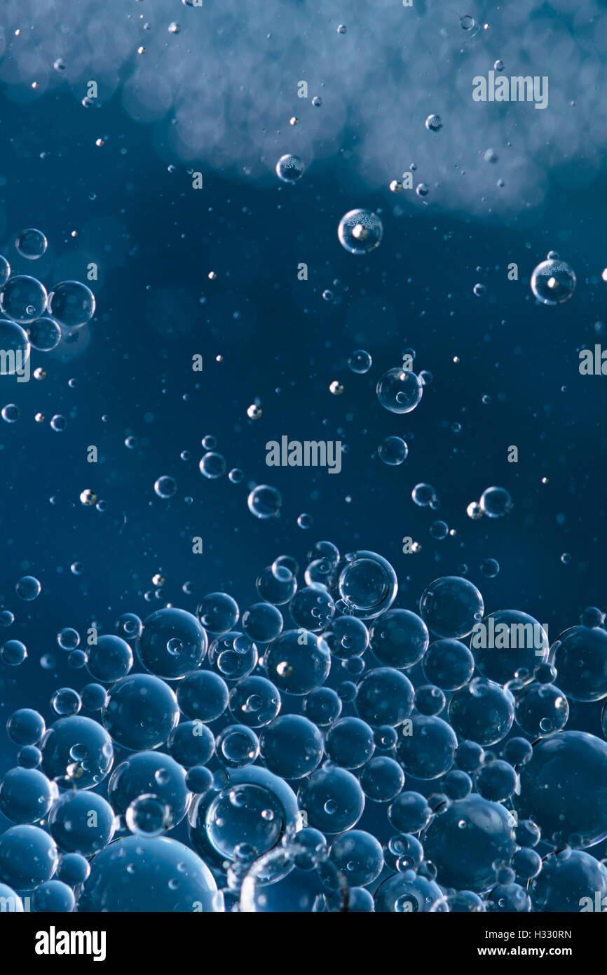 Blue rising bubbles Stock Photo - Alamy