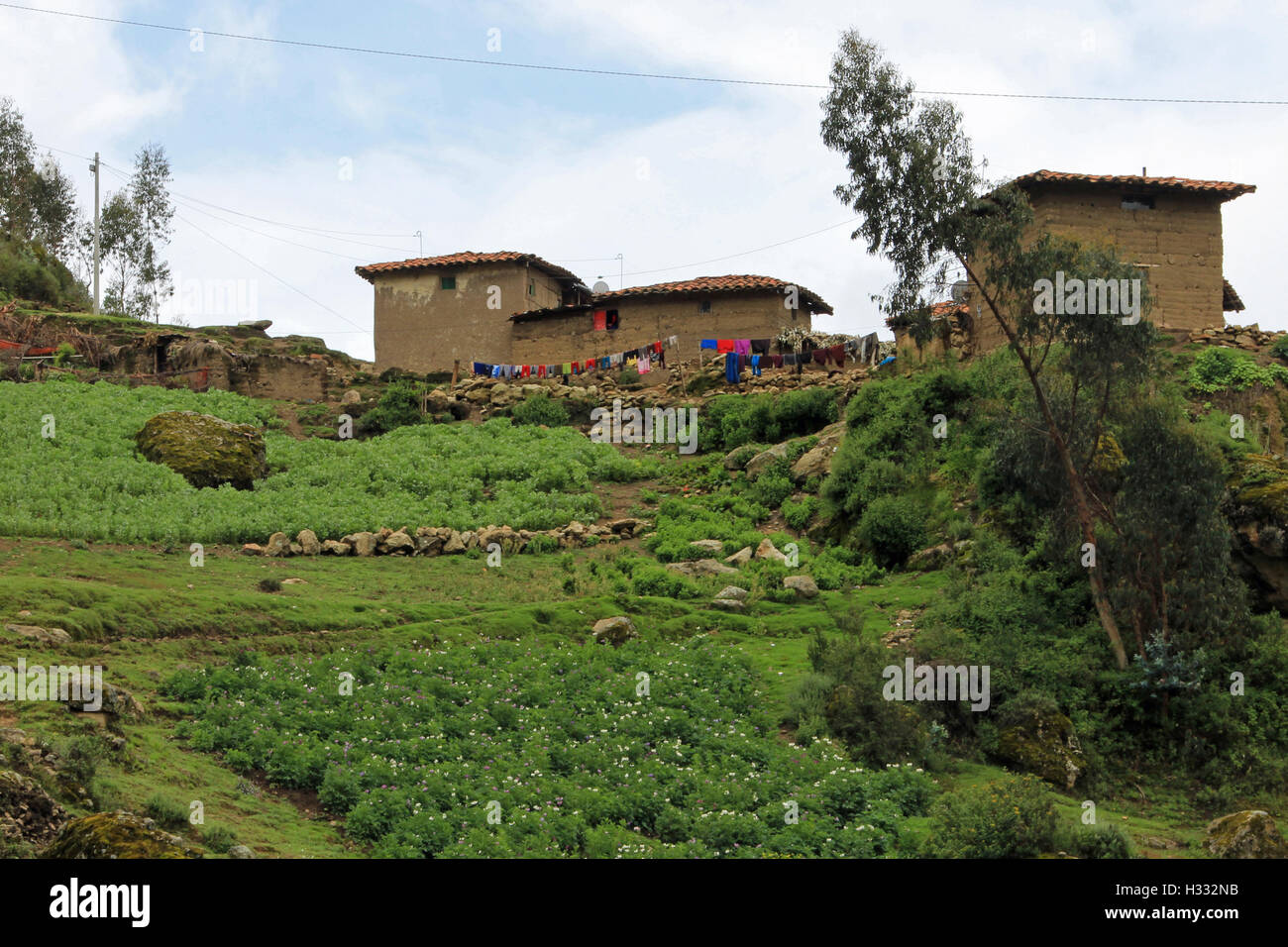 Traditional farmer house in the peruvian mountains with their laundry ...
