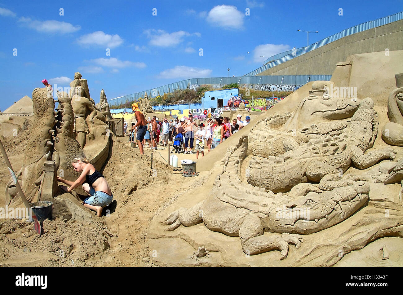 Girl making Egyptian sand sculpture on Brighton Seafront Stock Photo ...