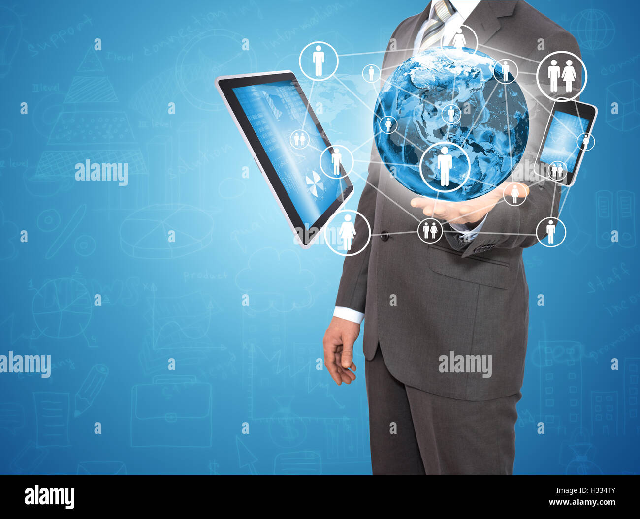 Businessman holding earth and electronics Stock Photo - Alamy