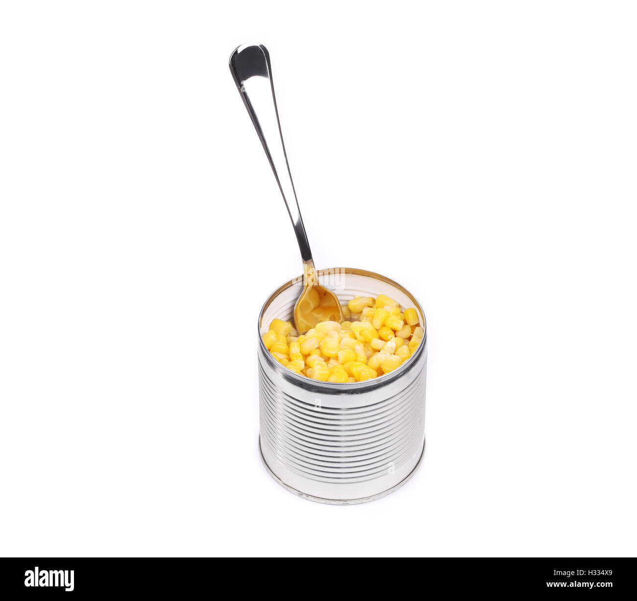 Canned corn in an opened can with spoon Stock Photo - Alamy