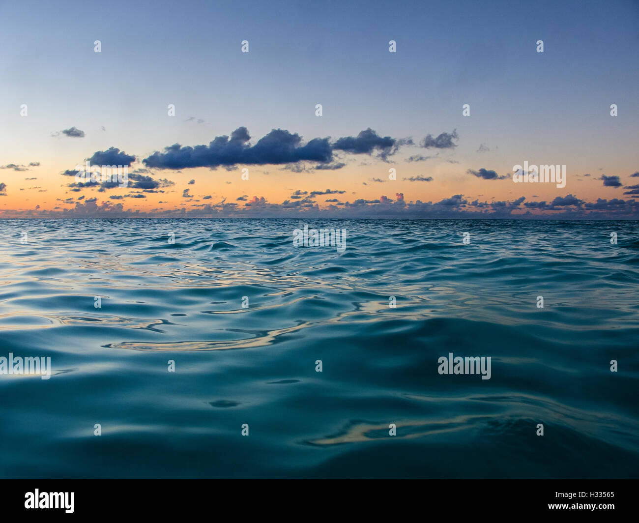 Sunset over ocean Stock Photo - Alamy