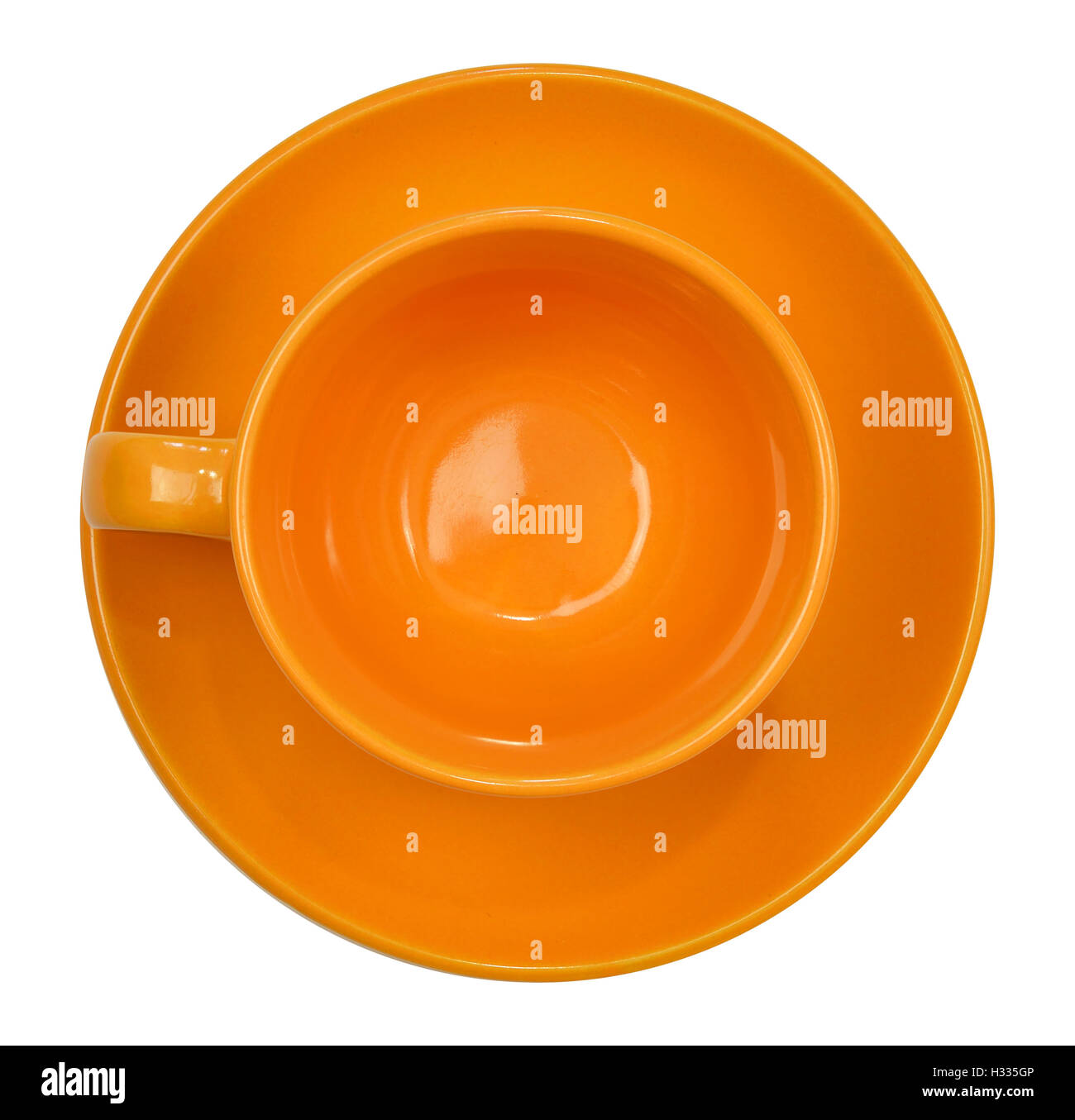 Orange cup with saucer Stock Photo - Alamy