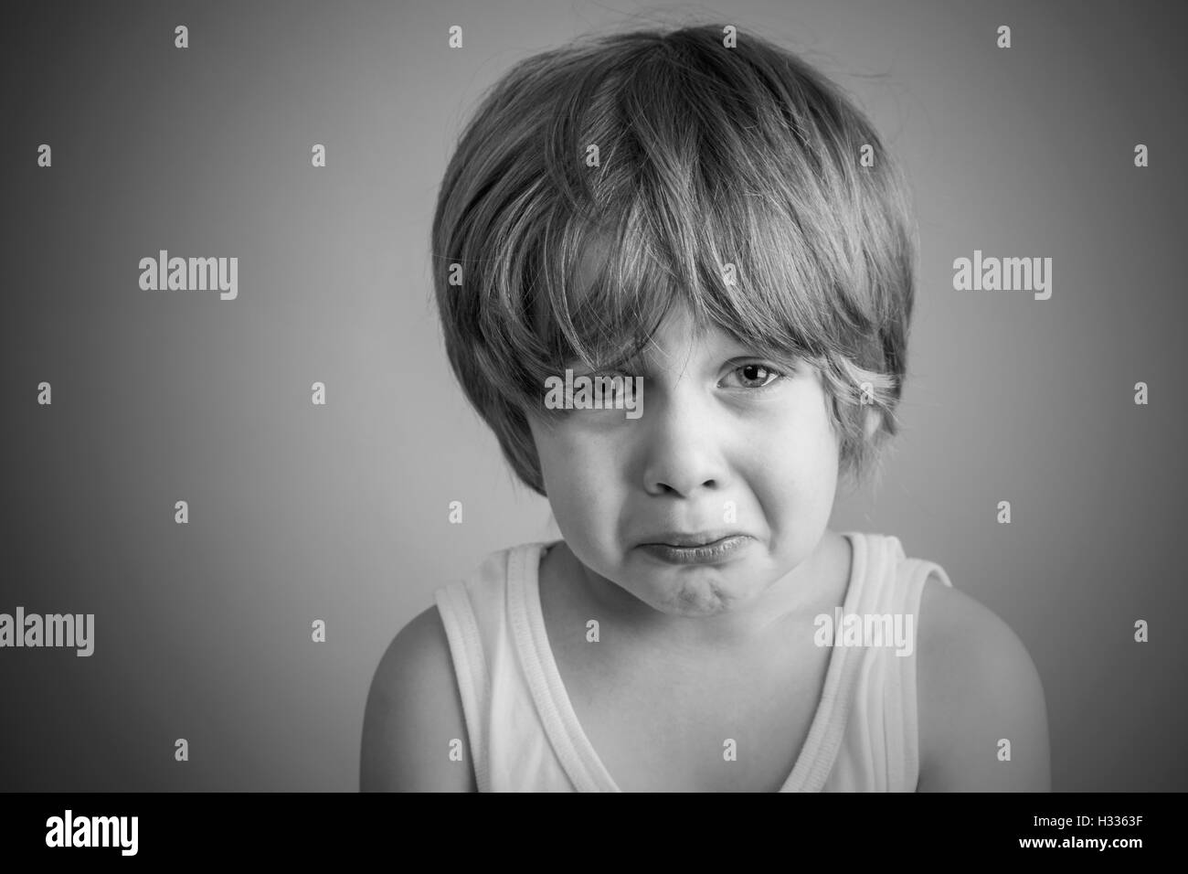Sad Young Boy Stock Photo - Alamy