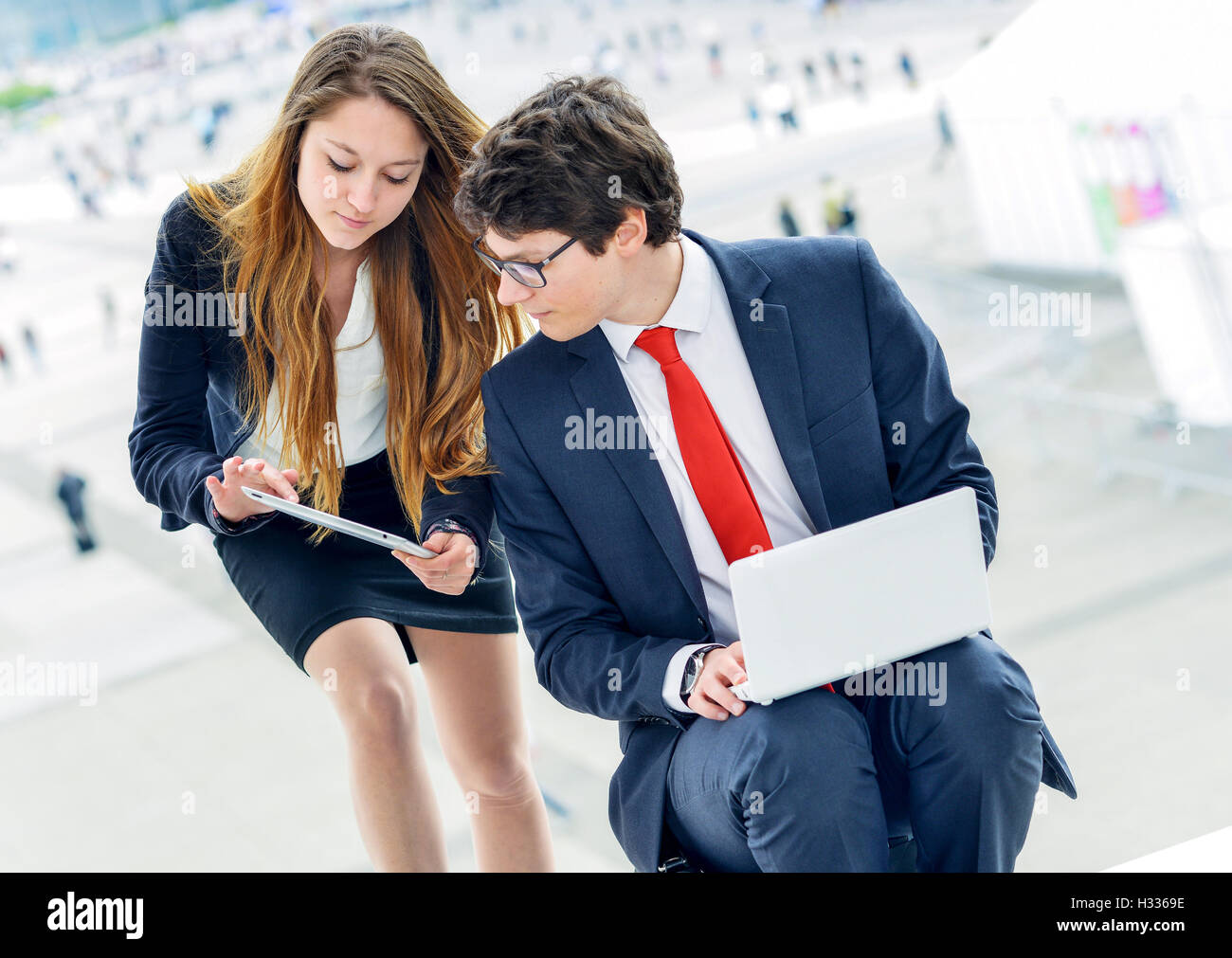 Junior executives dynamics working outside of their office Stock Photo ...