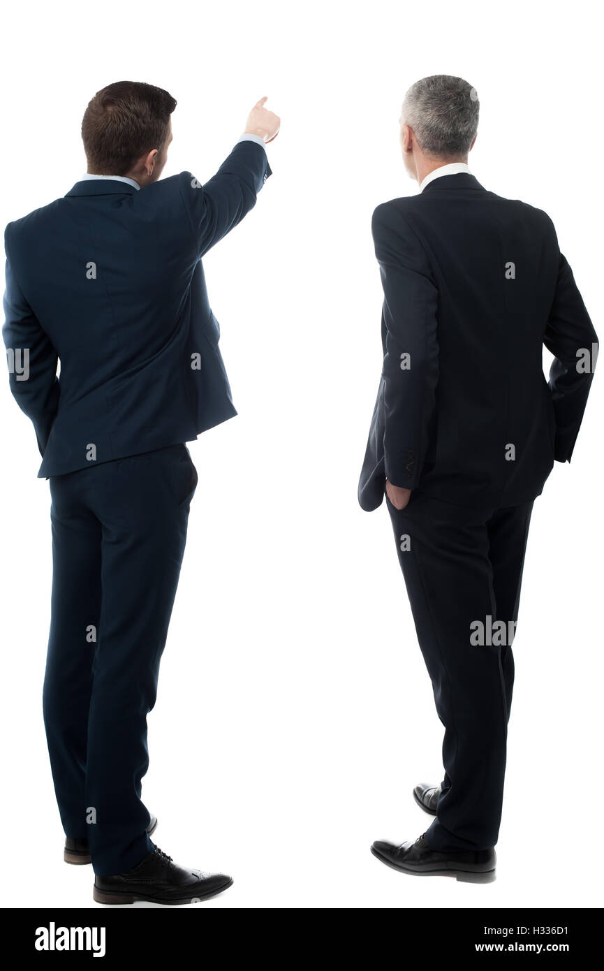 Rear-view image of two businessmen Stock Photo - Alamy