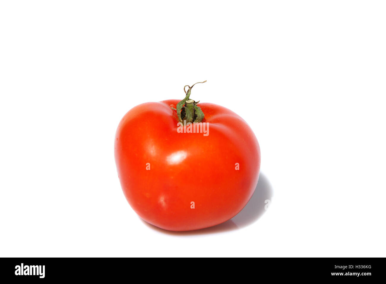 one tomato isolated on white Stock Photo - Alamy