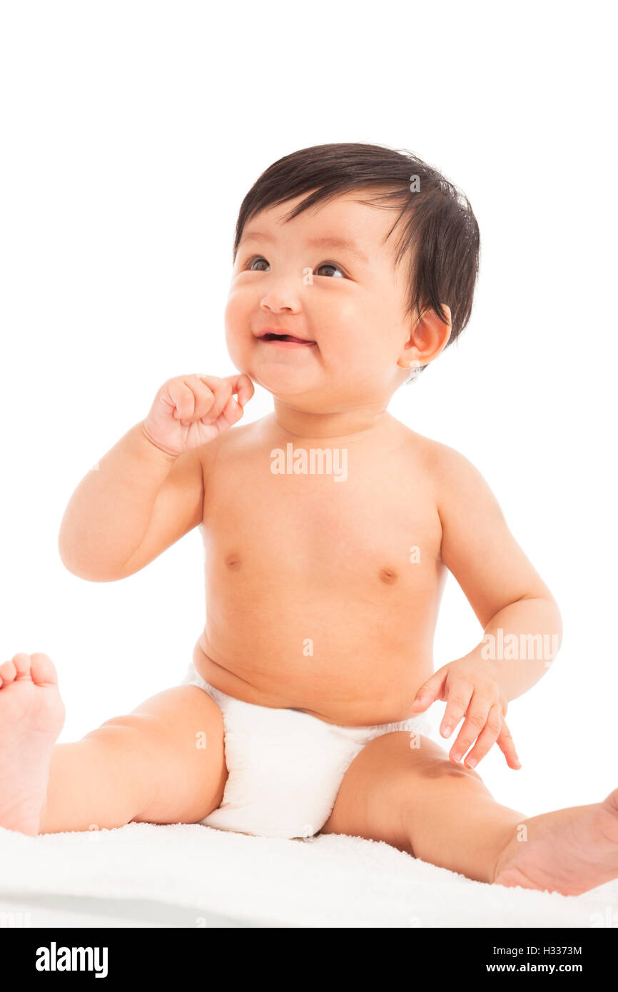 smiling Infant child baby sitting and look up Stock Photo - Alamy