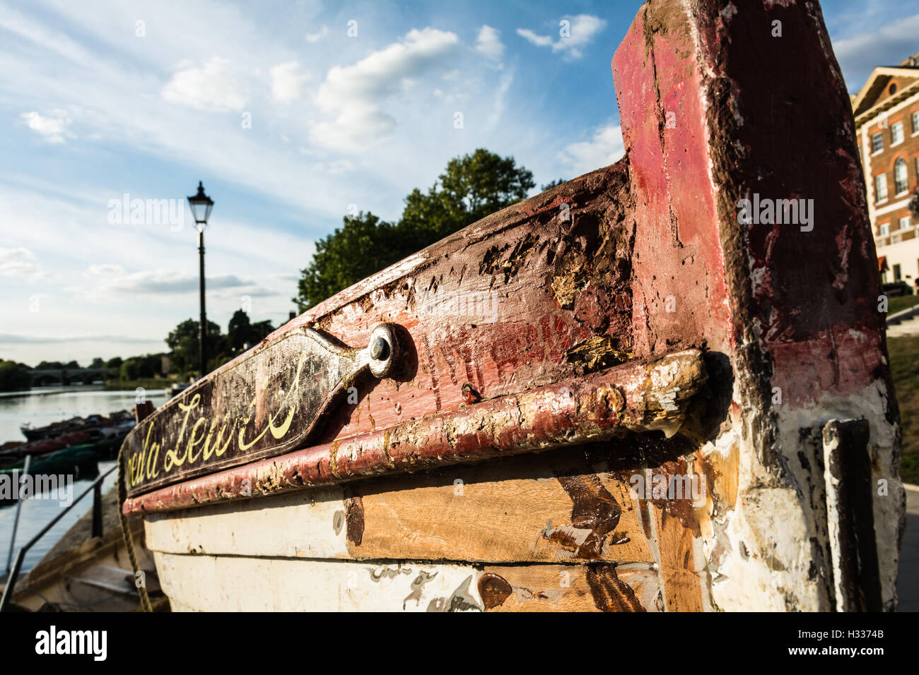A closeup of a weathered and rotting bow of an old boat on the River ...