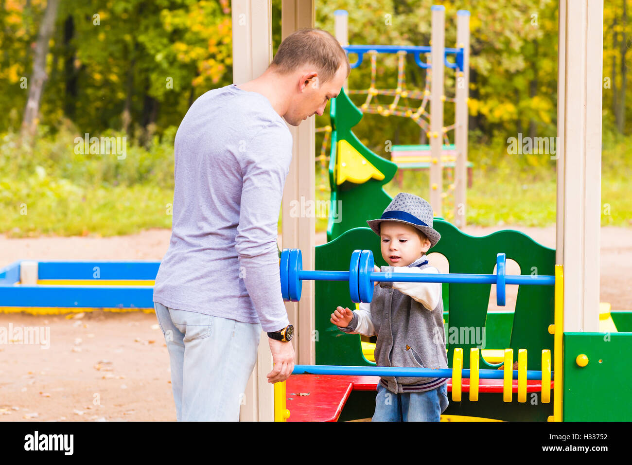 playful child with father at the playground outdoor Stock Photo - Alamy