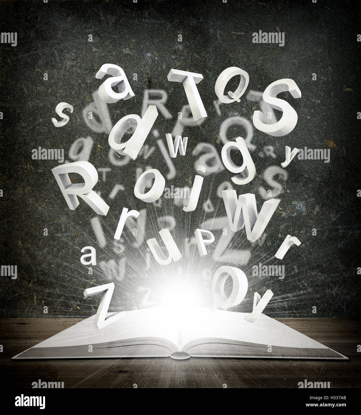 Letters are emitted from an open book Stock Photo - Alamy