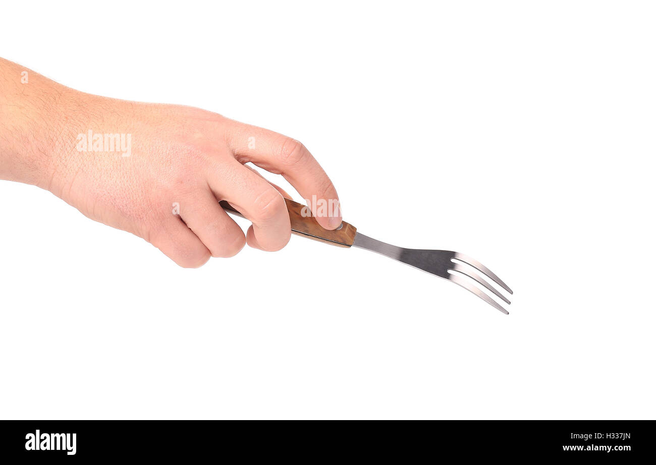 Kitchen fork in hand Stock Photo - Alamy