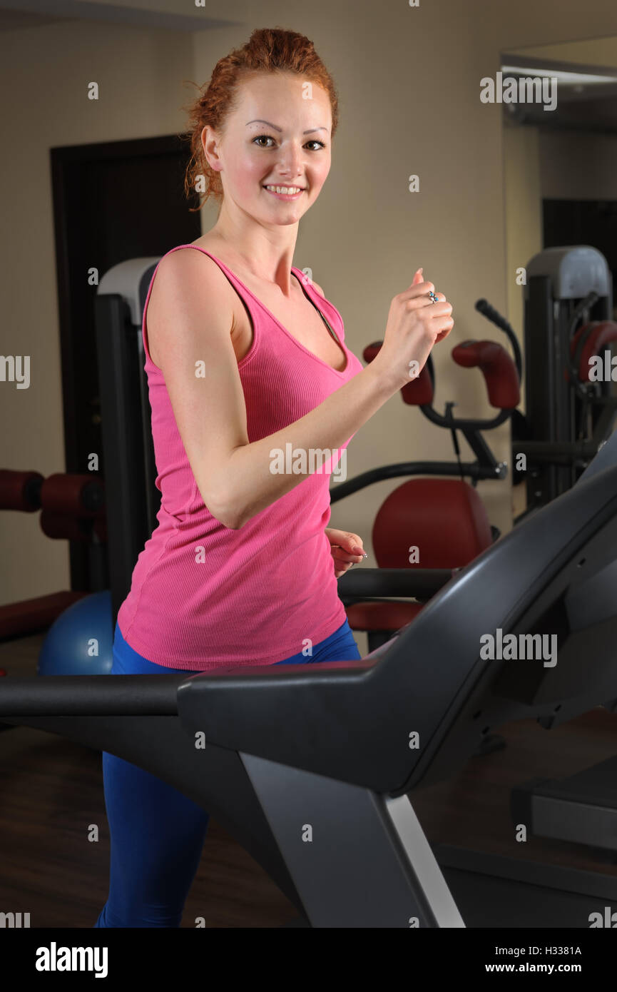 young man running at treadmill in gym Stock Photo - Alamy