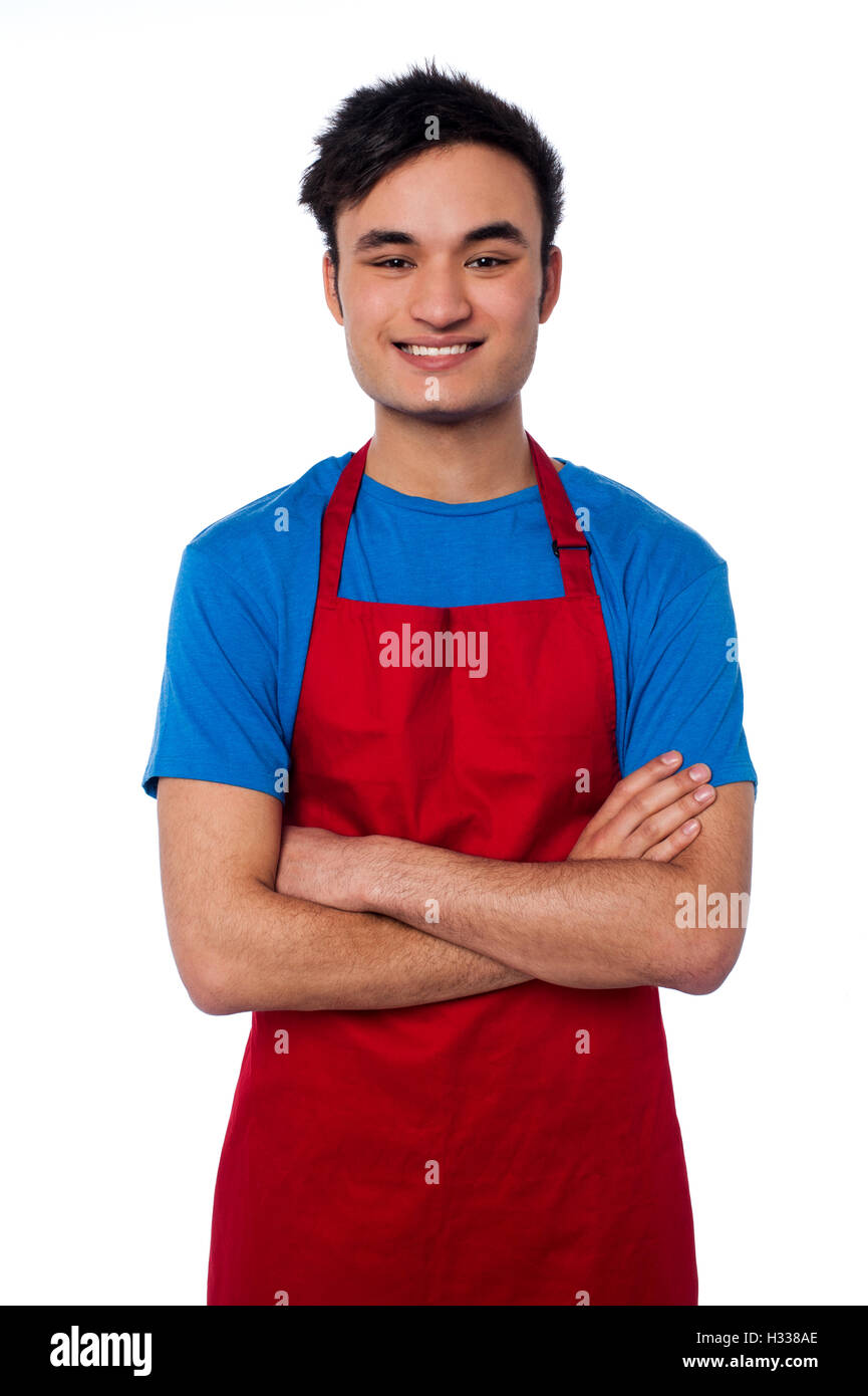 Handsome chef posing with arms crossed Stock Photo - Alamy