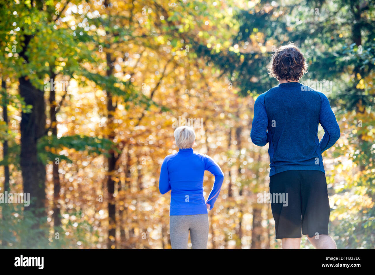 Couple in sportswear in the forest hi-res stock photography and images ...