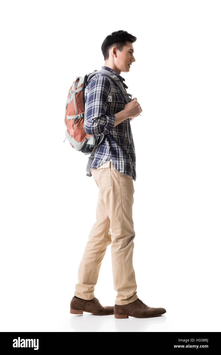 Side view of young Asian backpacker Stock Photo - Alamy