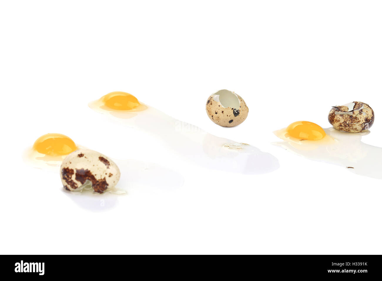 Broken quail eggs Stock Photo - Alamy
