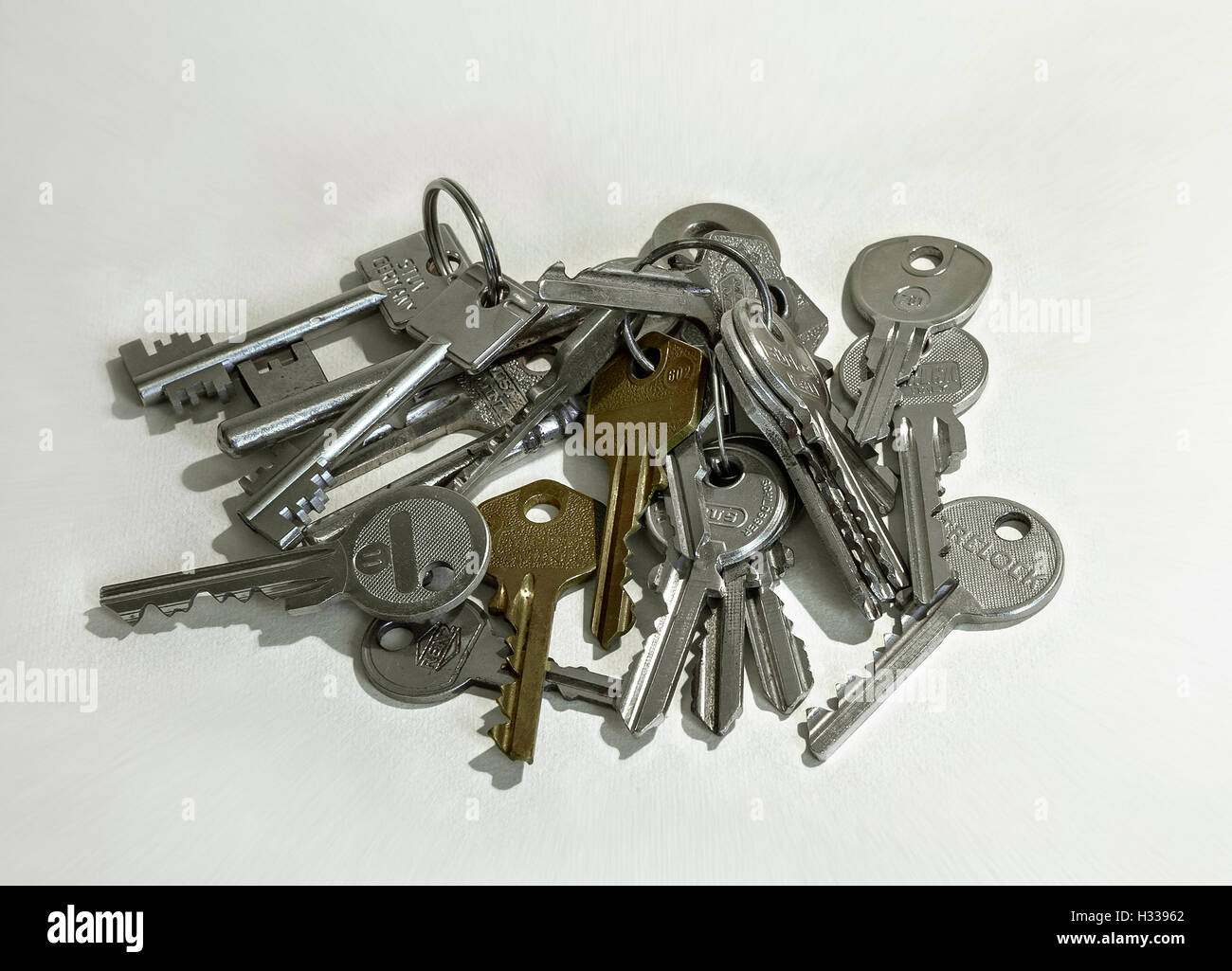 Different keys, white background Stock Photo - Alamy