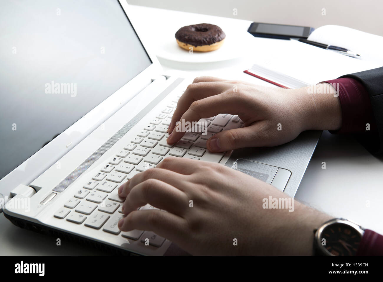 human hand on the notebook keyboard Stock Photo - Alamy