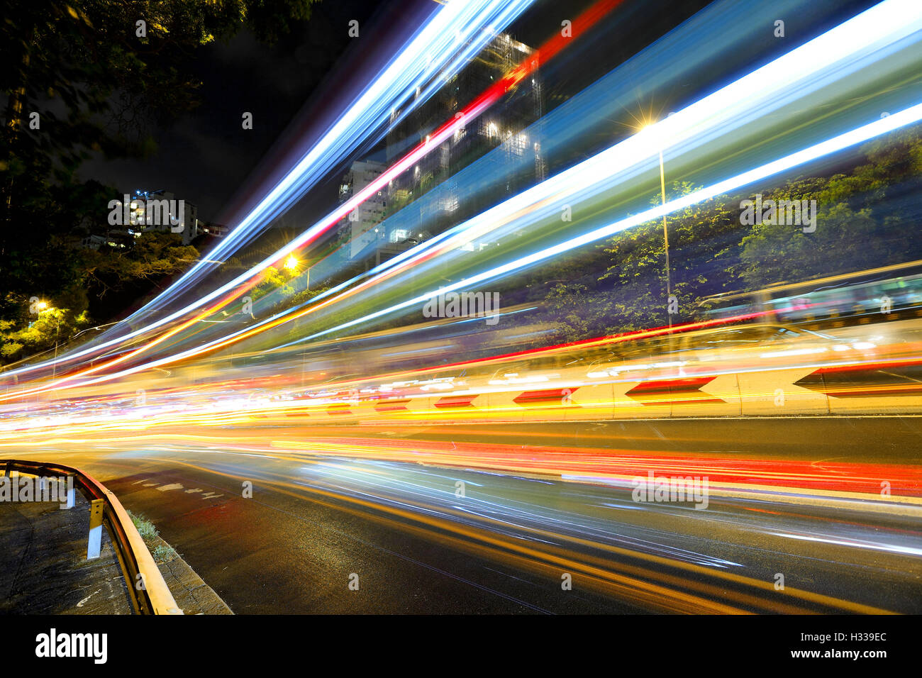 Fast moving car light on road at night Stock Photo - Alamy