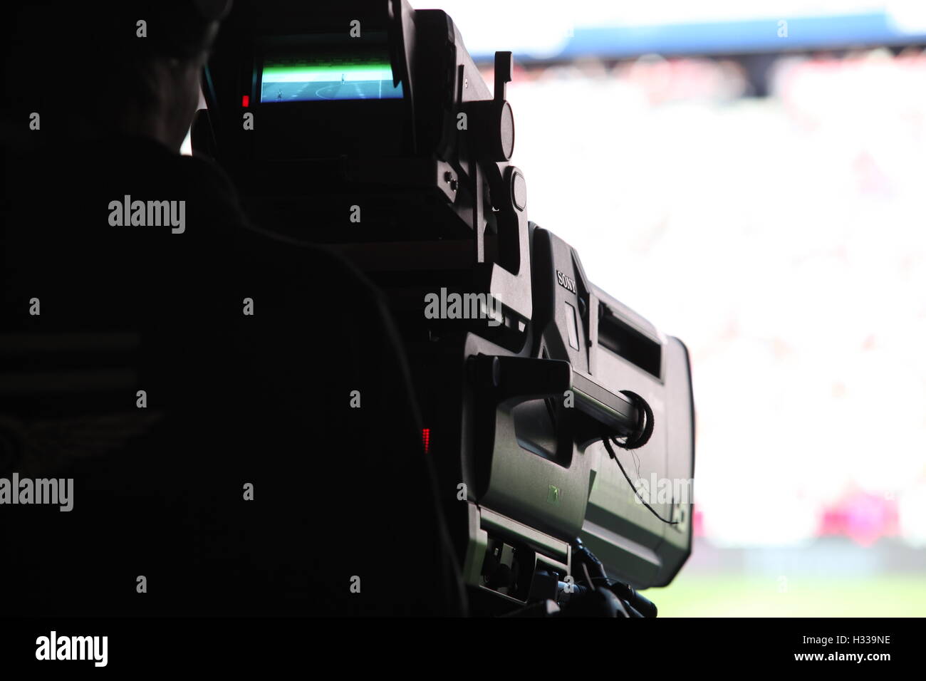 Camera in a stadium during a football match Stock Photo - Alamy