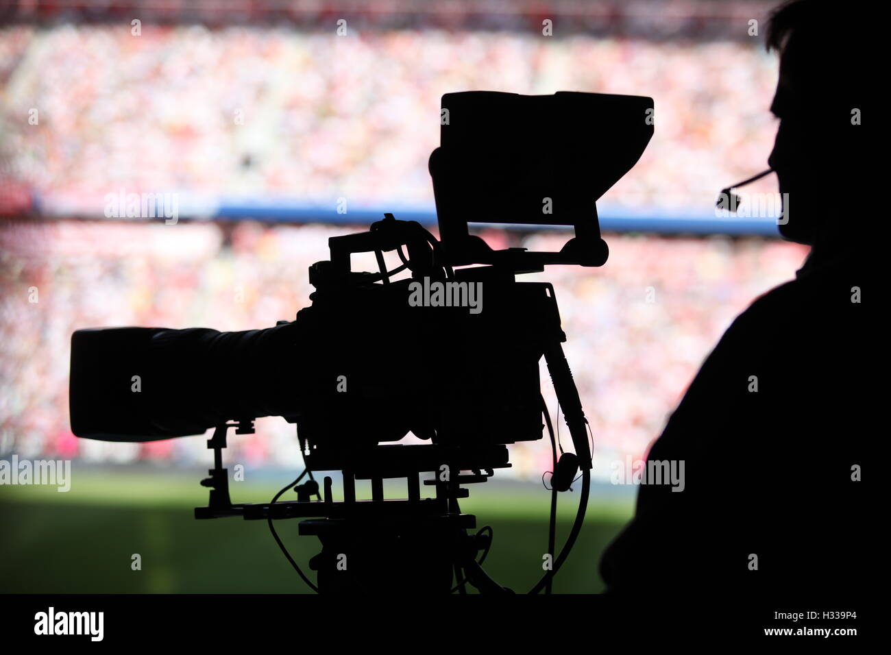 Cameraman in a stadium during a football match Stock Photo - Alamy