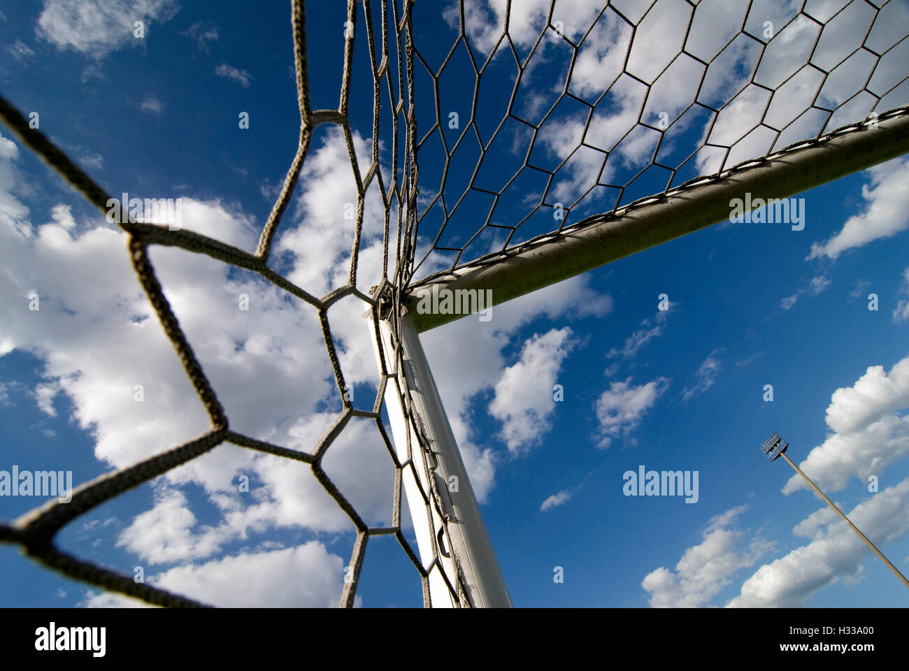 Football, goal, detail, blue sky, white clouds and the Cologne ...