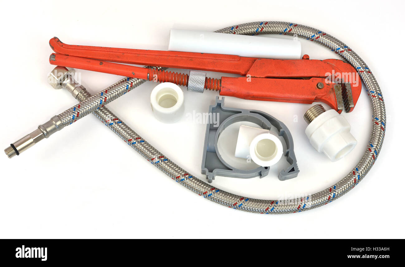 Pipe wrench and plumbing parts Stock Photo - Alamy