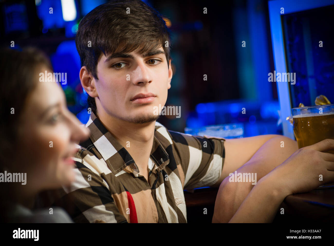 portrait of a young man at the bar Stock Photo - Alamy