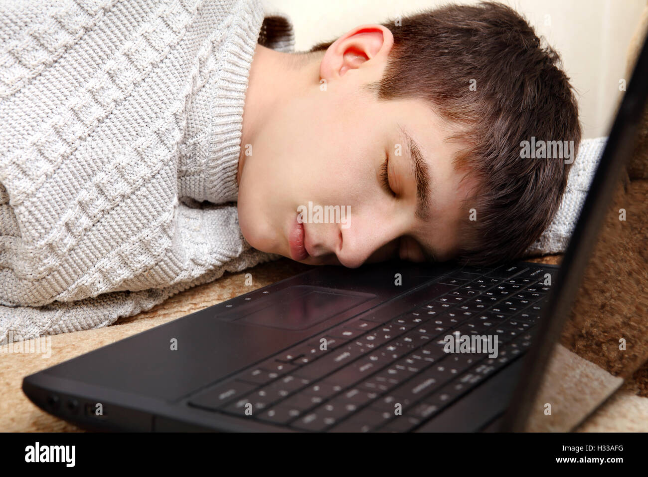 Teenager sleeps on Laptop Stock Photo - Alamy