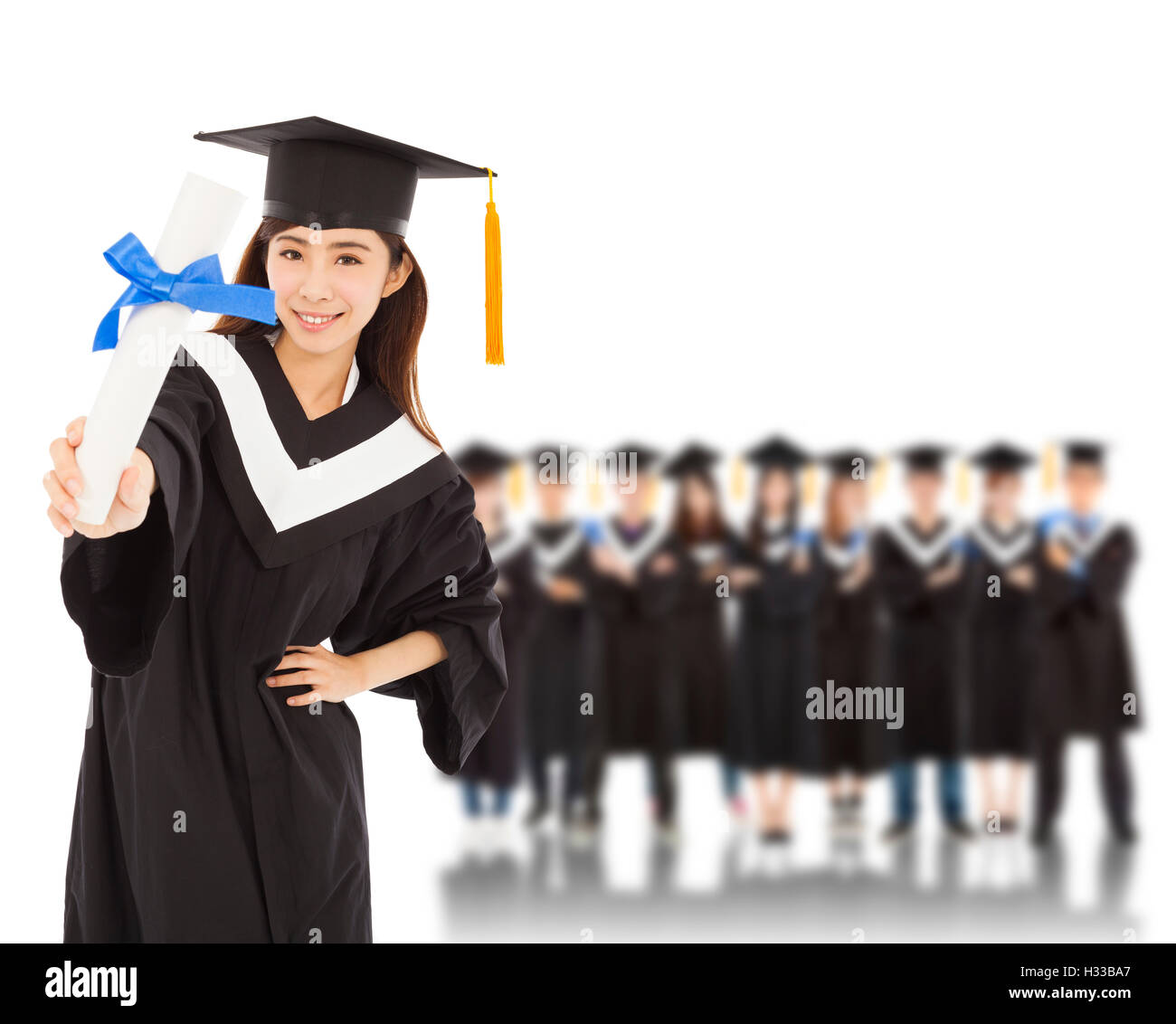 young woman college graduate with students Stock Photo - Alamy