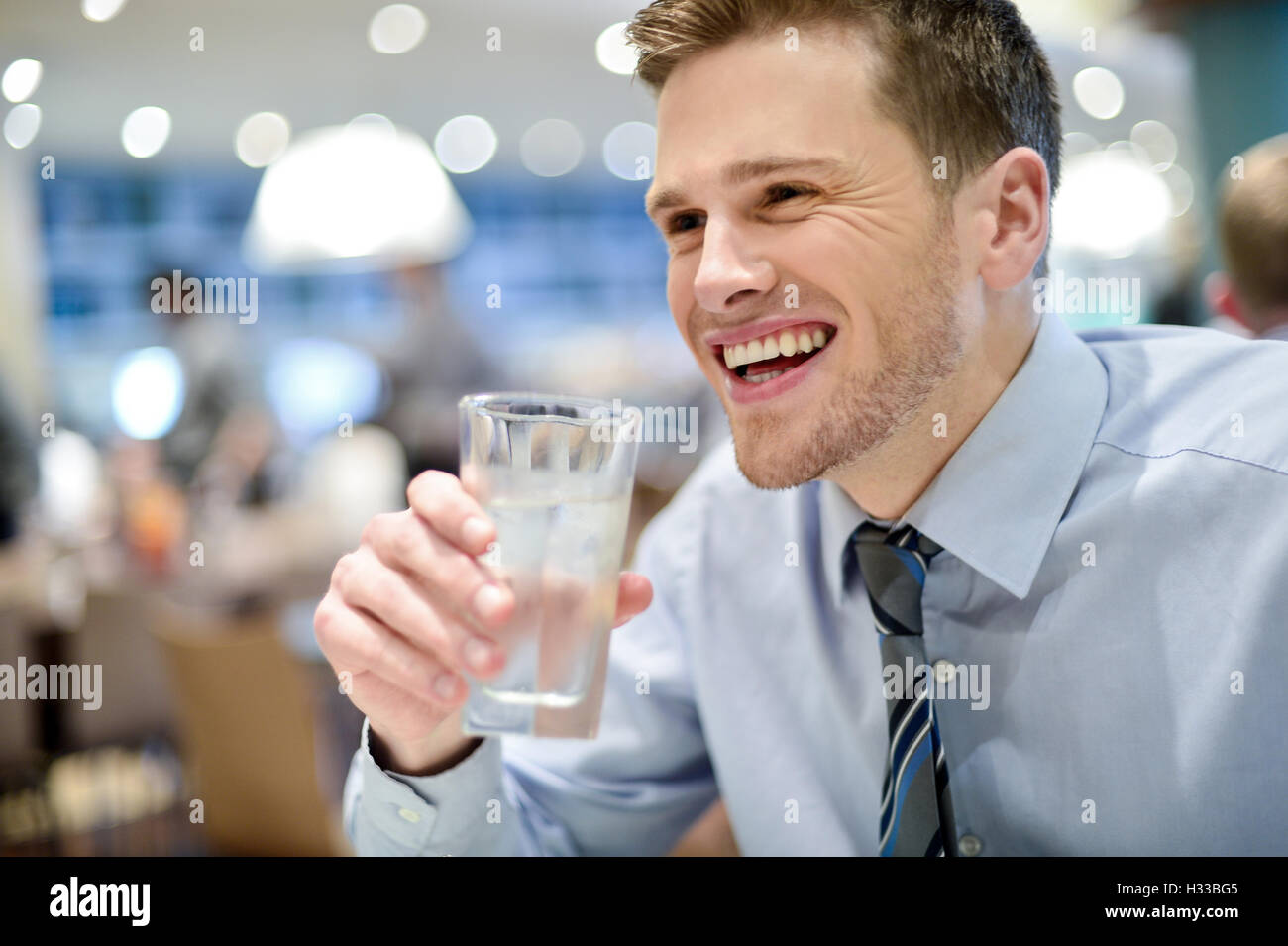 Smiling man drinking water hi-res stock photography and images - Alamy