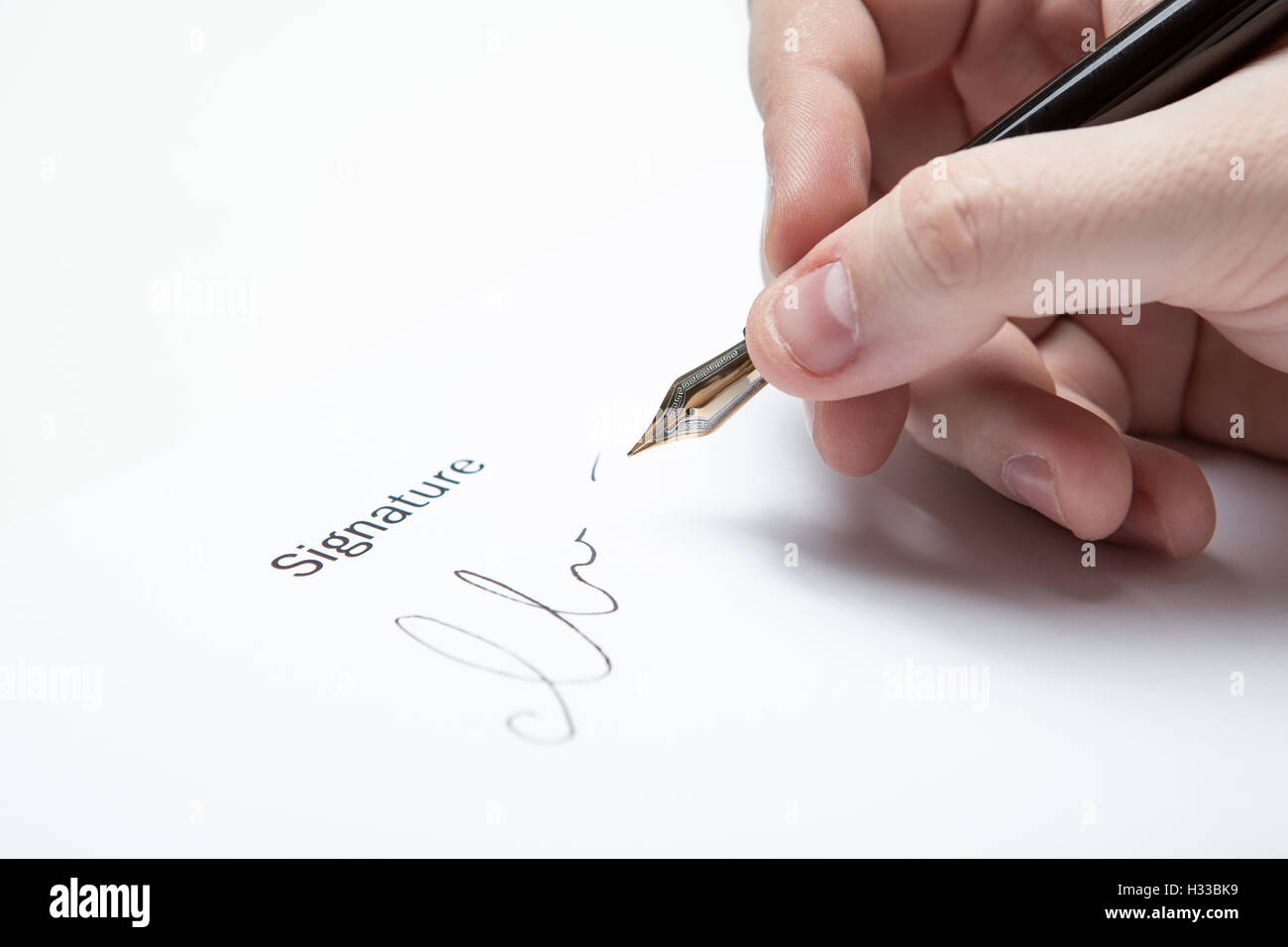 pen in the man's hand and signature Stock Photo - Alamy