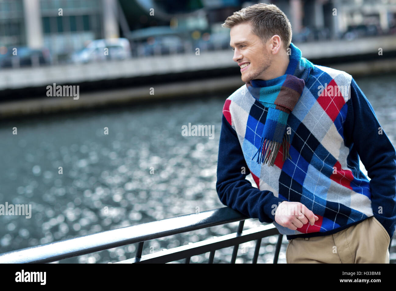 Stylish young man watching the river Stock Photo - Alamy