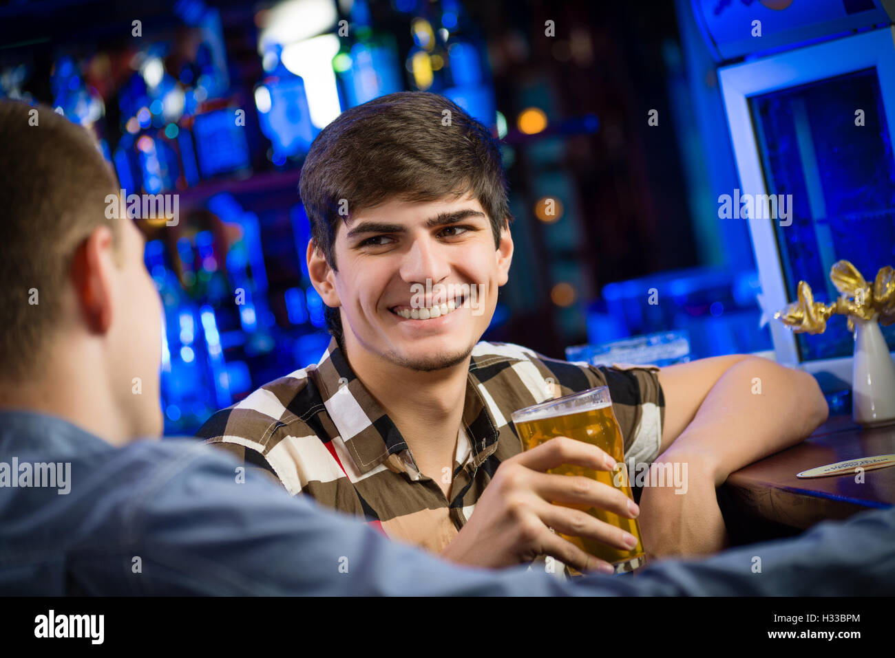 portrait of a young man at the bar Stock Photo - Alamy