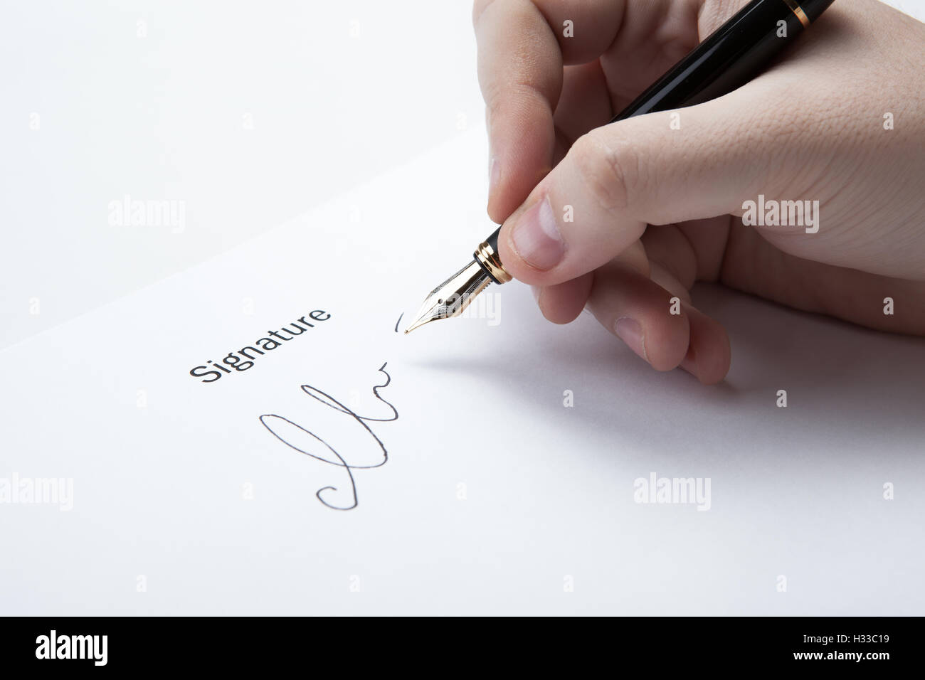Mans hand signs document pen hi-res stock photography and images - Alamy