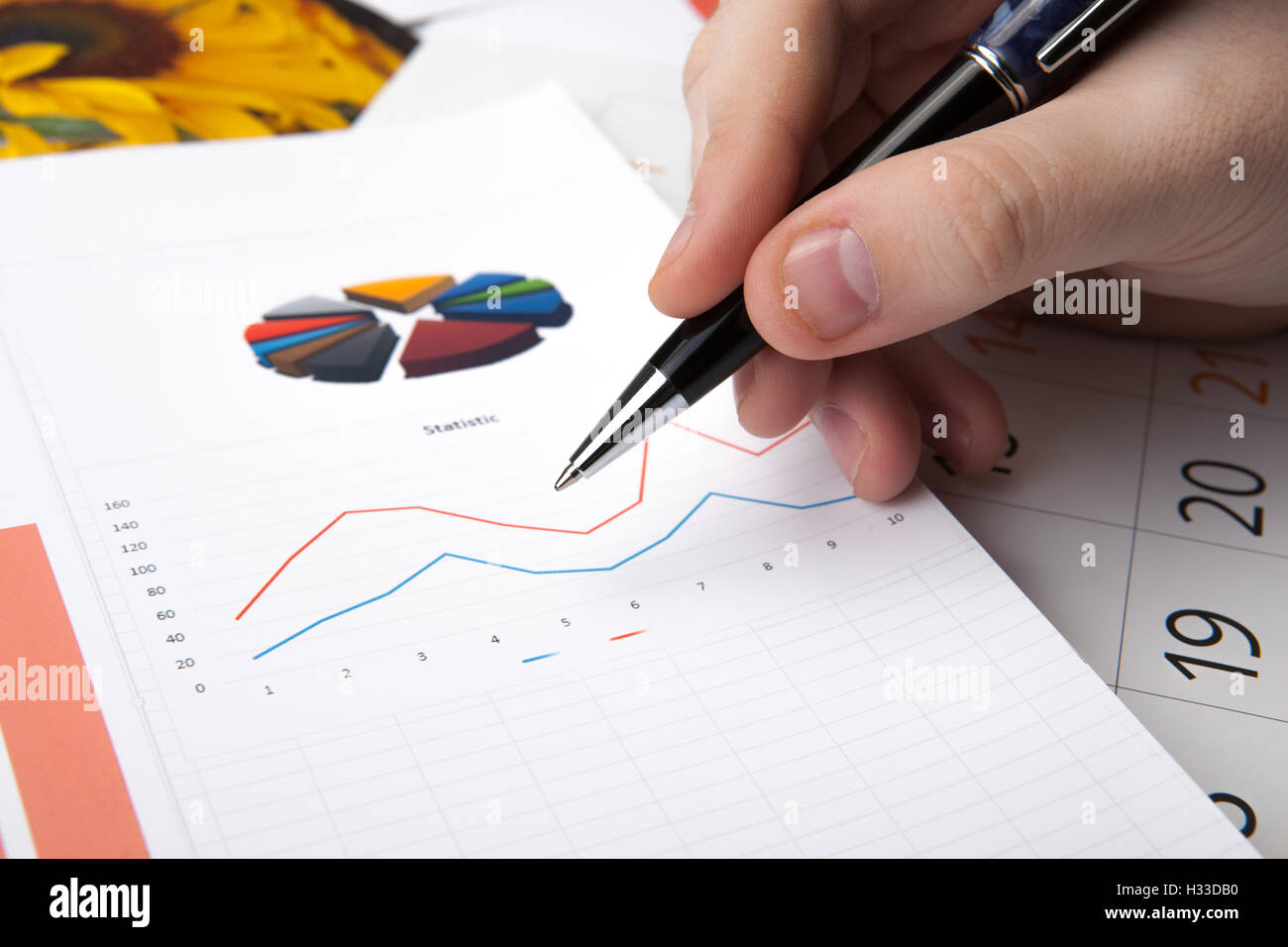 work studying the chart in the office Stock Photo - Alamy