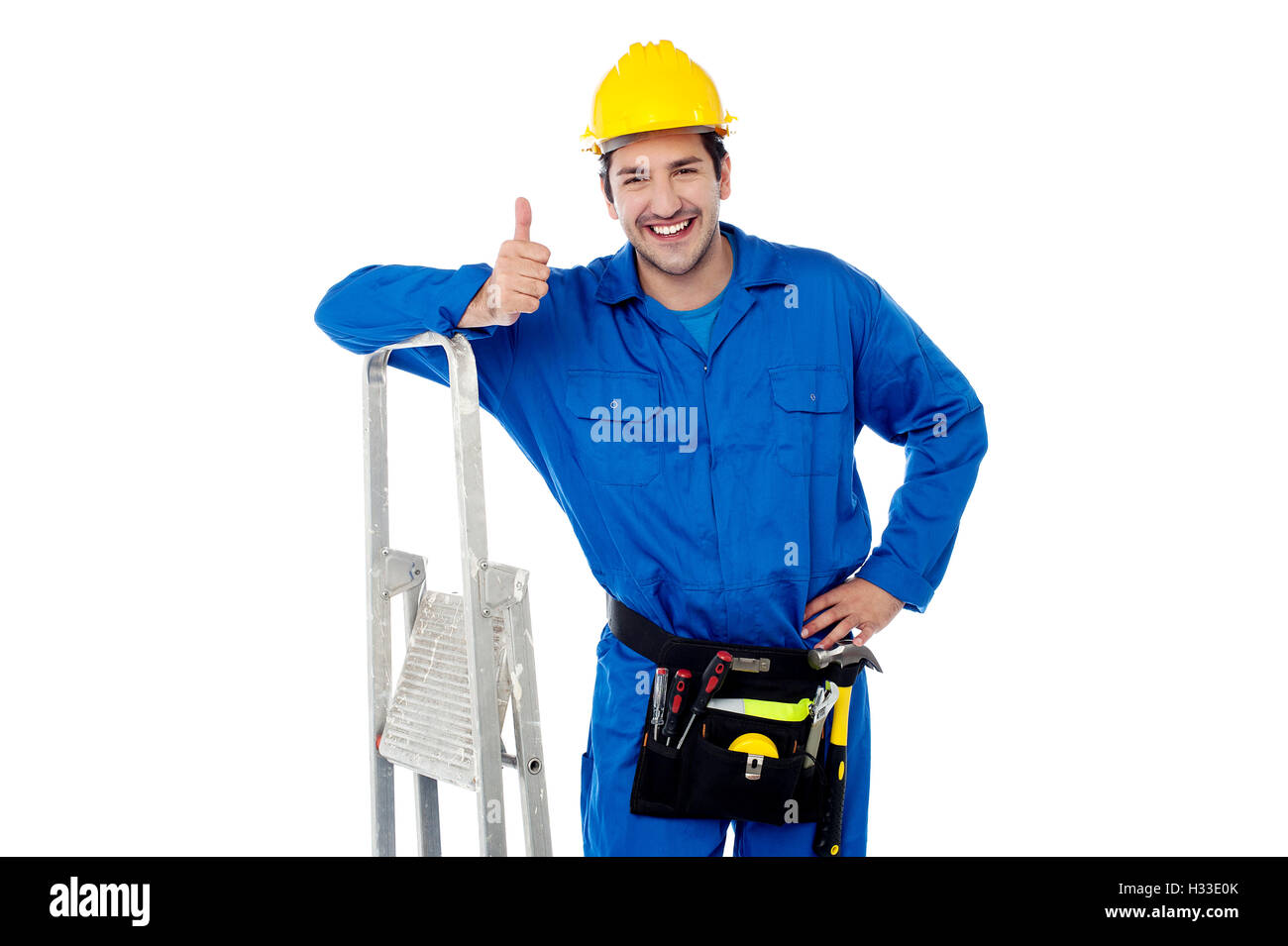 Construction worker posing with step ladder Stock Photo - Alamy