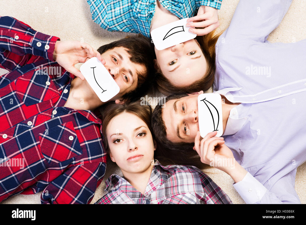 four young men lie together Stock Photo - Alamy