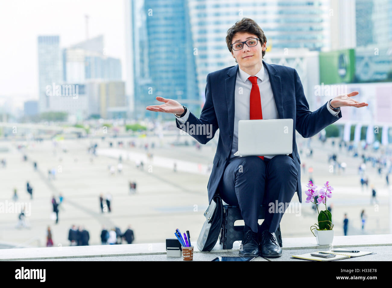 Junior executive dynamic working outside of his office Stock Photo - Alamy